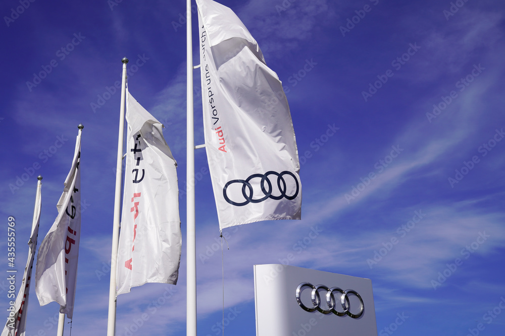 Audi sign text flag and brand logo front of vehicle shop German ...