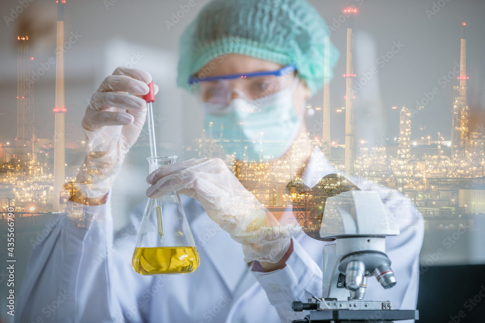 Double exposure scientist wearing uniform and glass holding test tube ...