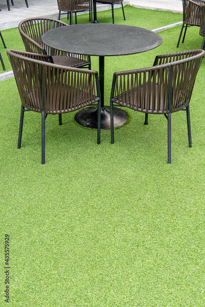 outdoor table set. Placed on an artificial green grass, table set for ...