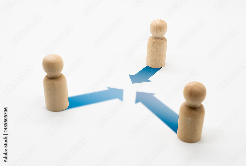 Wooden human arrow with joint venture arrow. Concept of team work ...