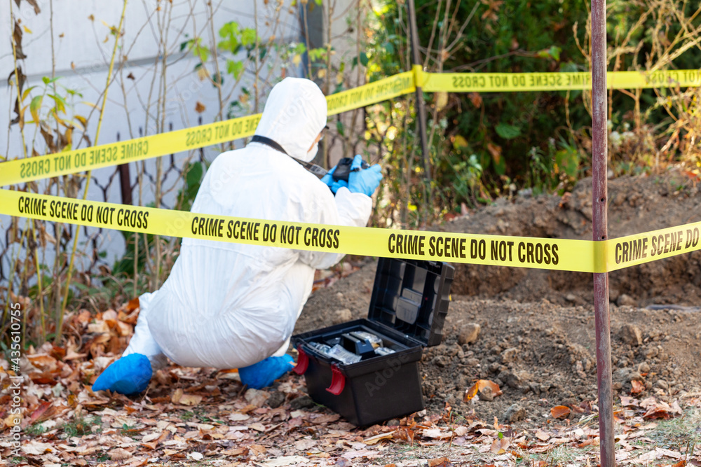 Crime scene investigation. Forensic science specialist photographing human remains. Stock Photo ...
