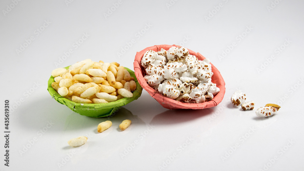 puffed rice and popped rice in pink paper packet on white background ...