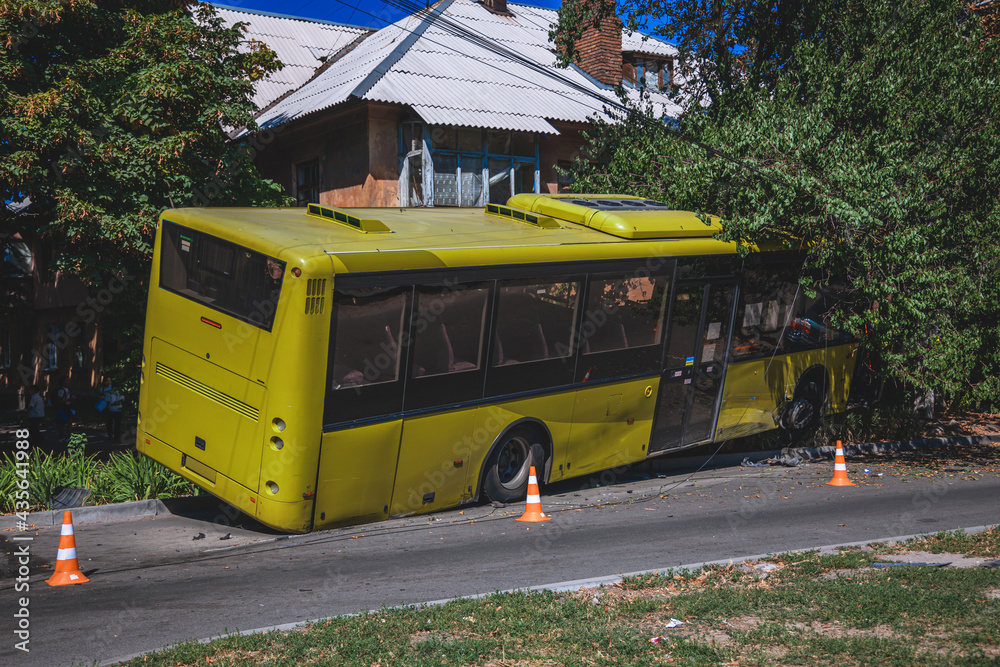The bus flew off the road and crashed into a tree. Broken windshield ...