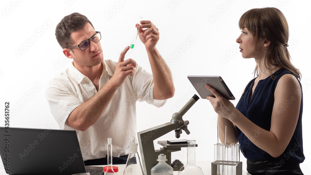 Young scientists working in laboratory. Scientists are engaged in ...