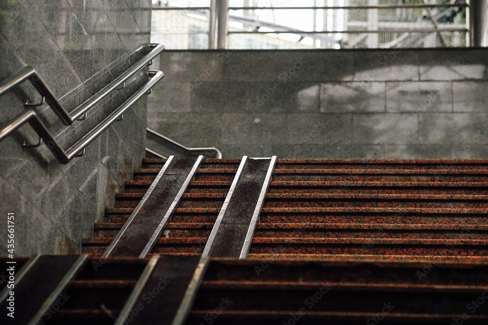 Gray staircase with a ramp for the disabled. Urban architecture. Exit ...