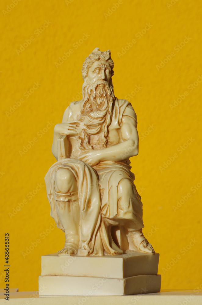 Scale reproduction of Michelangelo's statue of Moses on an orange ...