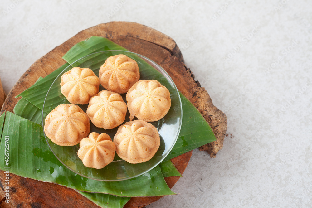 Sponge cake baked in special aluminium moulds also called Kueh Bolu or ...