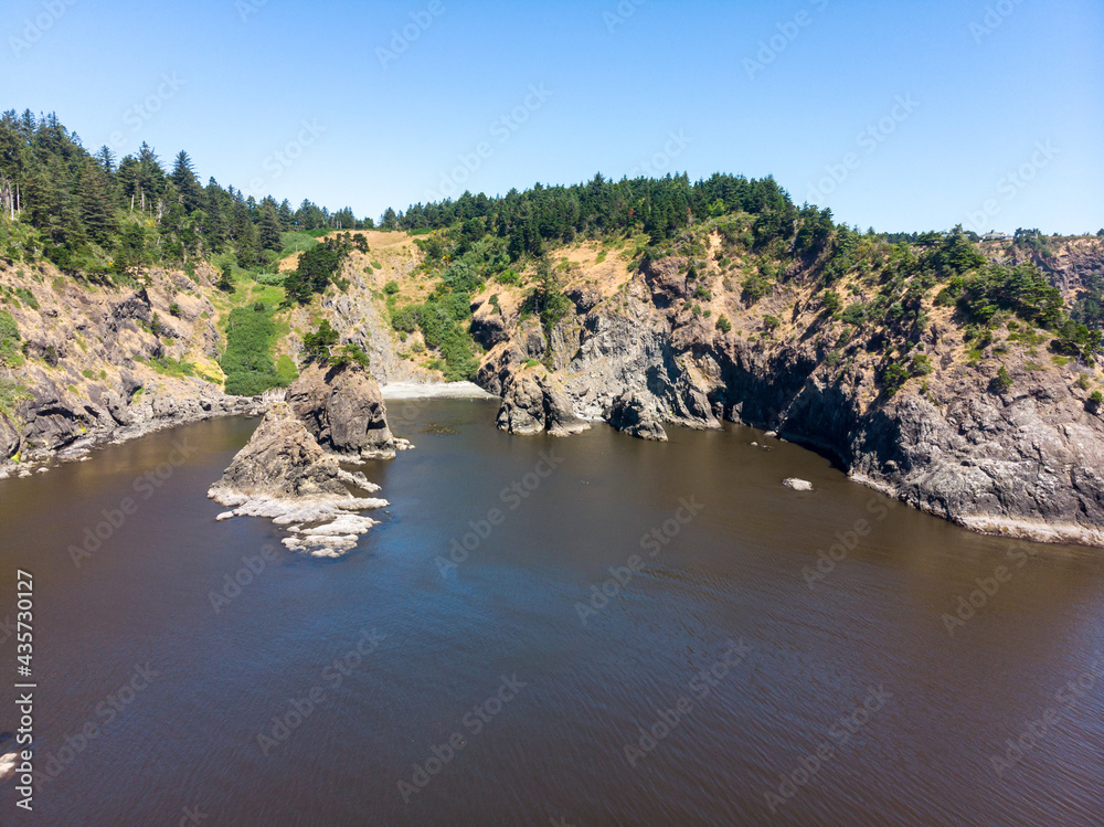 Aerial panorama of Nellies Cove at Port Orford, Oregon. An inlet of ...