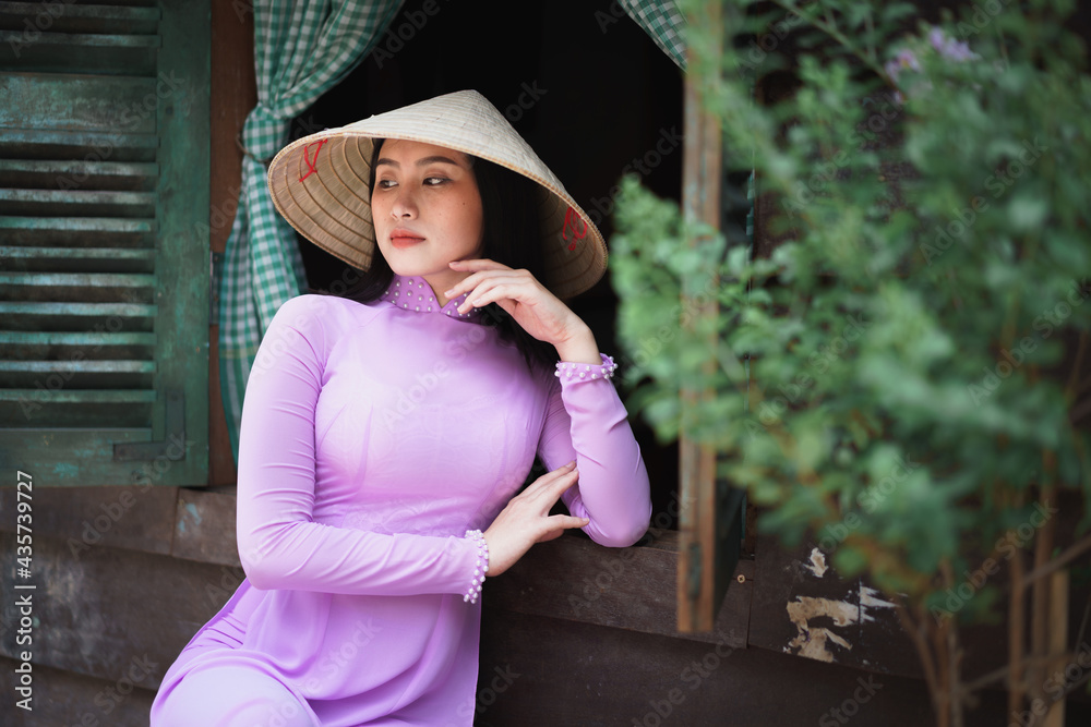 Beautiful vietnamese woman in Ao Dai Stock Photo | Adobe Stock