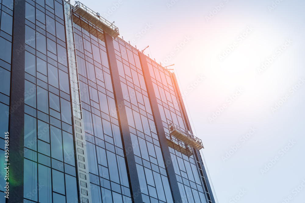 Suspended construction craddle near wall of hightower residentaial ...