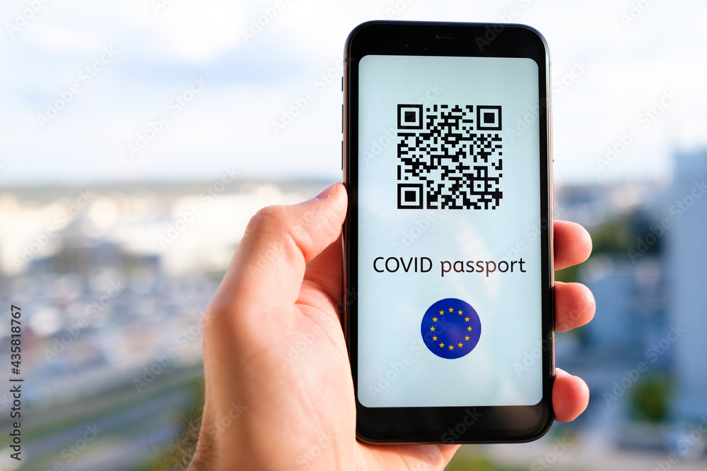 Covid pass with QR code with European Union flag on the screen in ...