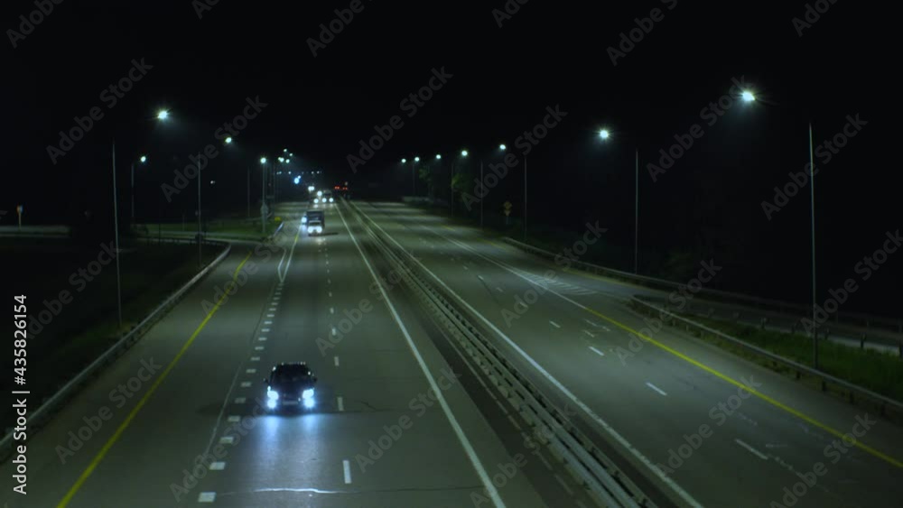 Night suburban highway with cars that rise from the Black Sea coast ...