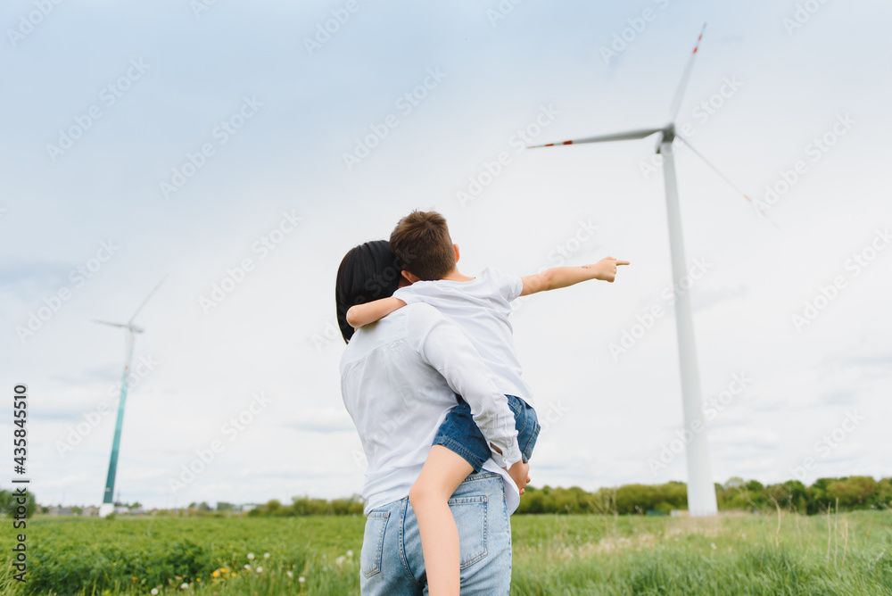 Alternative energy, wind farm and happy time with your family. Happy ...