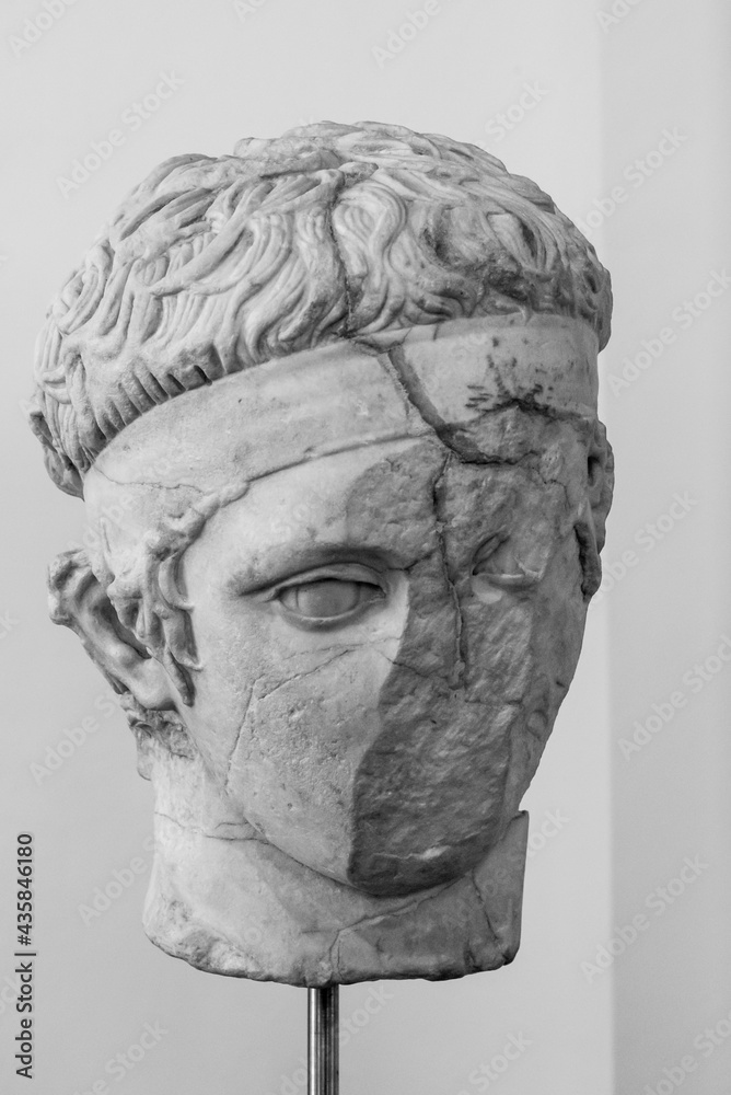 Black and white photo of close-up on ruined face of ancient roman ...