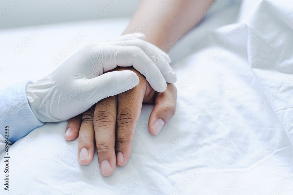 Male doctors wear medical gloves holding touching hands man patient ...