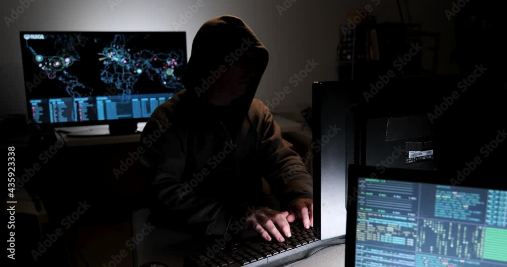 Computer hacker types code attempting to hack a computer server Stock ...