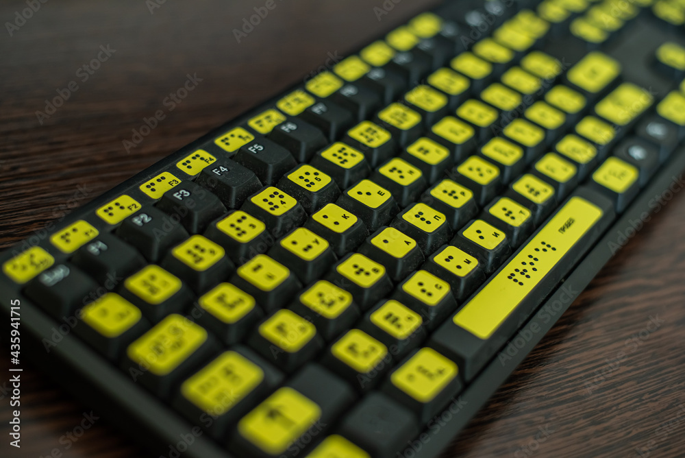Close-up of a keyboard with the Russian alphabet for the blind. Braille ...