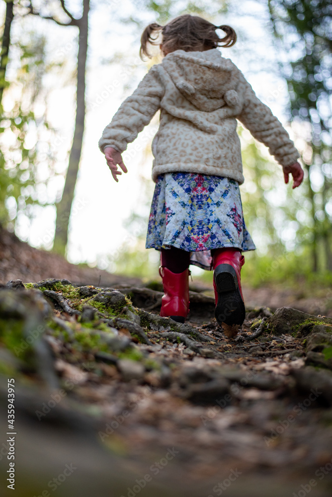 child makes way up a rooty path Stock Photo | Adobe Stock