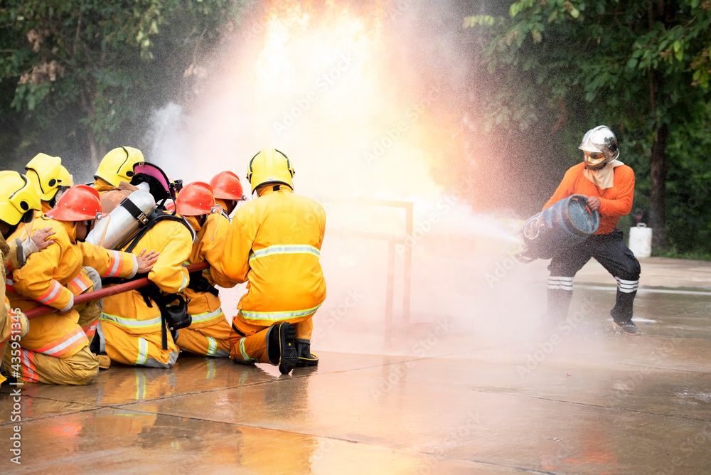 Firefighters train firefighters to use water and fire extinguishers to ...
