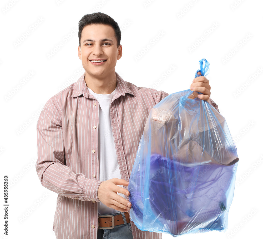 Young man with garbage bag on white background Stock Photo | Adobe Stock