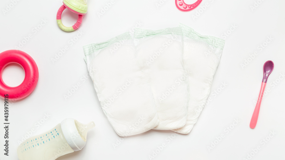 baby background. products, shopping, diapers , toy, comb, bottle with ...