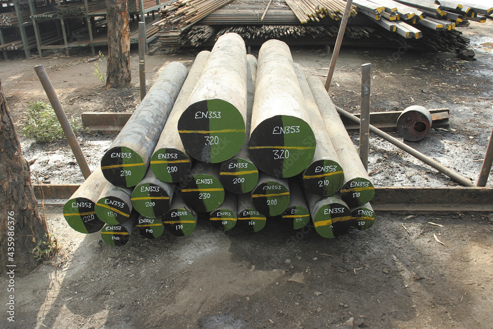 metal rods, steel bars and metal blanks with marking kept in warehouse ...