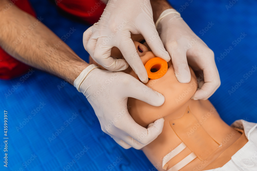 Endotracheal tube intubation. Closeup of hands holding laryngoscope ...