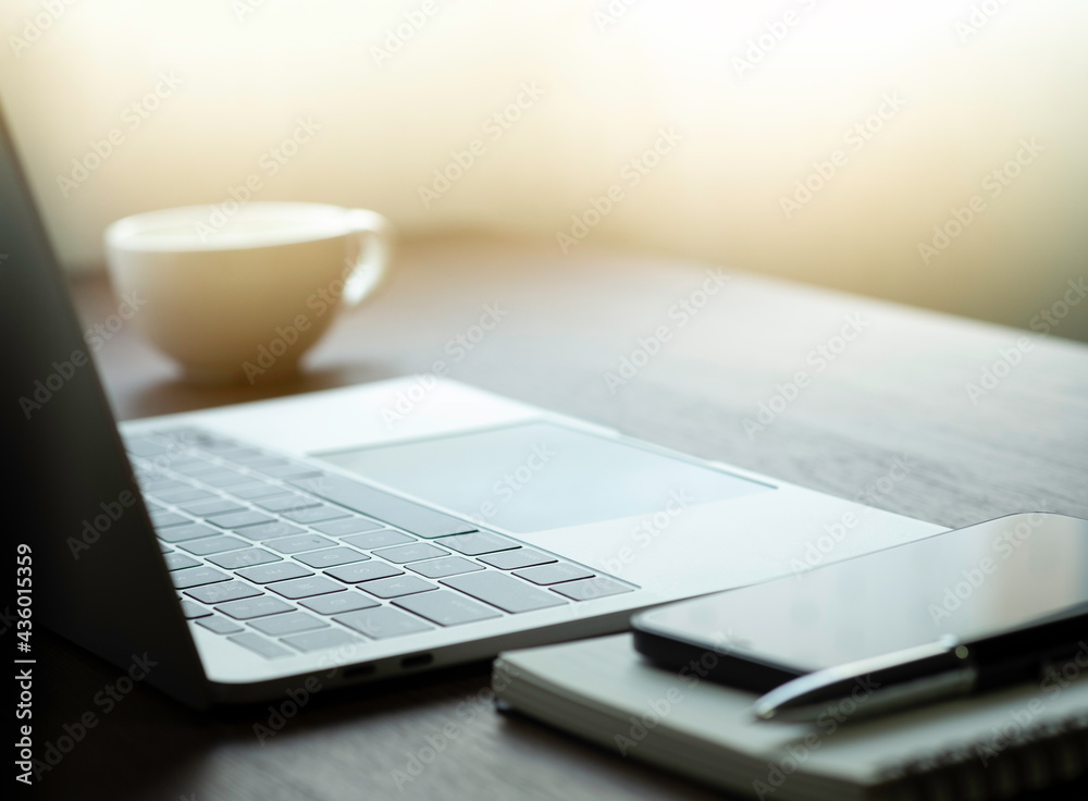 soft focus of Office desk table with keyboard of laptop computer ...
