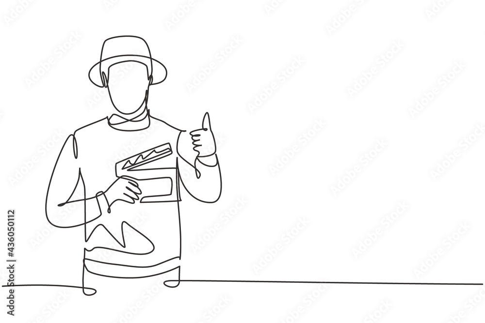 Single continuous line drawing the film director with a thumbs-up ...