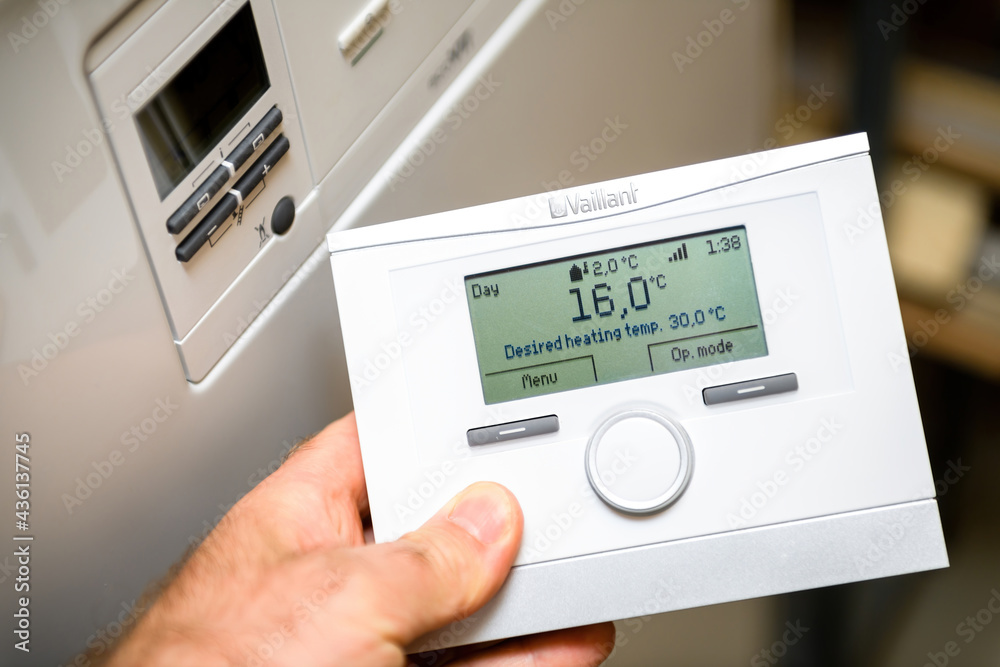 London, United Kingdom - Apr 7, 2021: POV male hand holding Vaillant ...