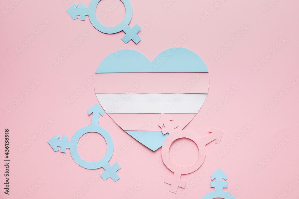 Paper heart with symbols of transgender on color background Stock Photo ...