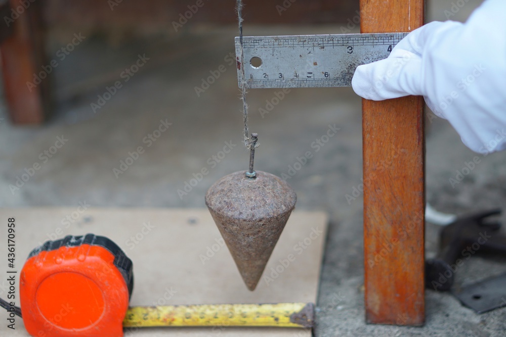 Foto de Old rusty metal plumb bob for construction . Thai carpenters or ...