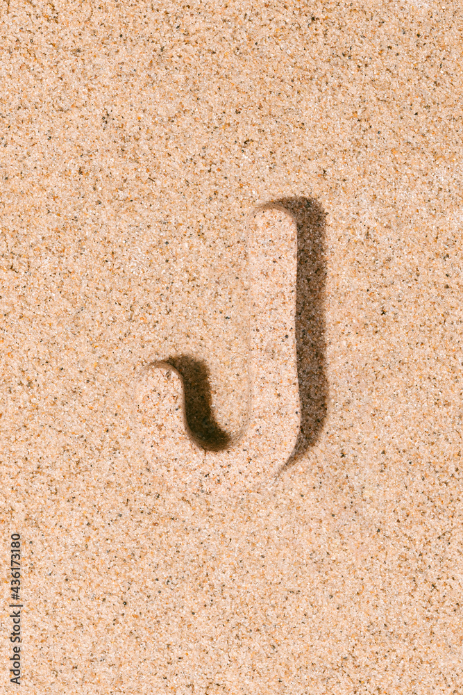 Letter J of the sand isolated on the beach sand. concept of summer ...