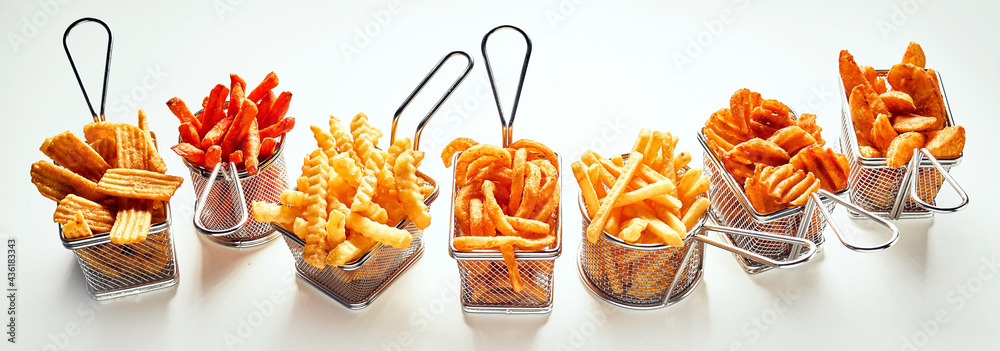 Frying baskets with different types of fries Stock Photo | Adobe Stock