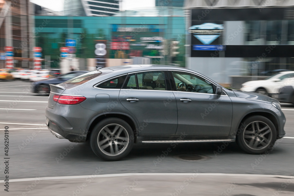 Gray Mercedes-Benz GLE SUV coupe car moving on the street Stock Photo ...