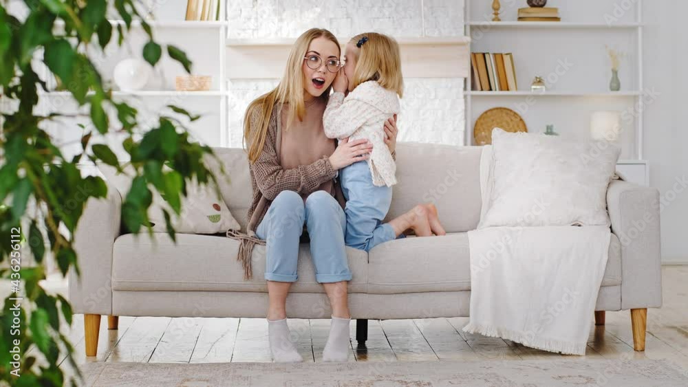 Caring mother babysitter listens to secrecy information with curiosity ...
