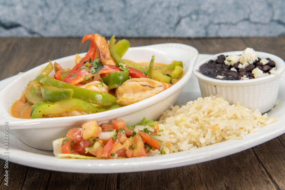 Shrimp smothered in green ranchero sauce cooked to perfection and ...