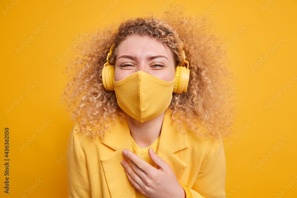 Emotions hidden behind mask. Cheerful joyful woman with curly hair ...