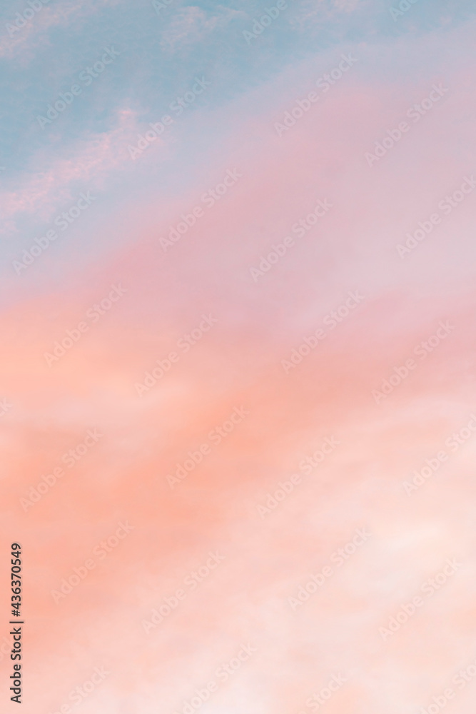 Vertical background formed by a bright pastel authentic sky during ...