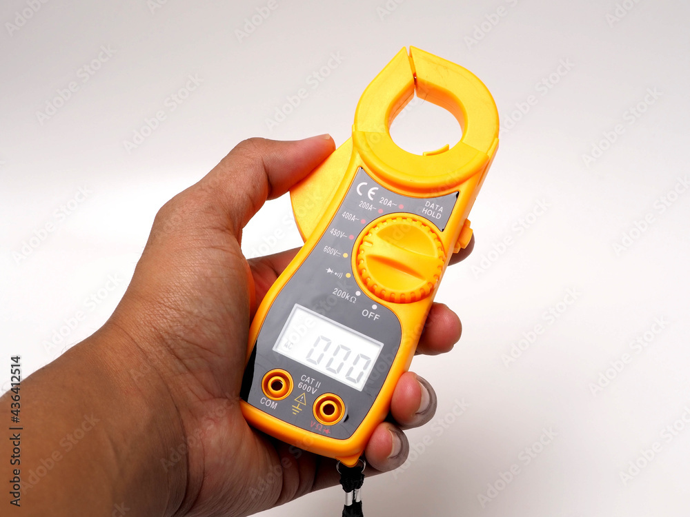 Picture of yellow digital clamp meter that using for measuring ...