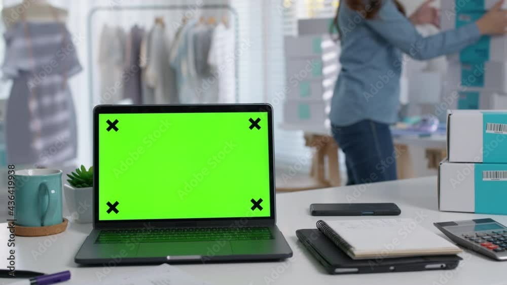 Notebook green screen on desk table home office designer studio ...