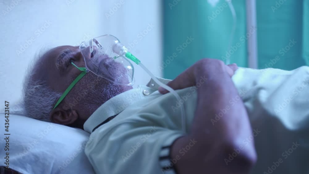 Old man feeling uncomfortable rubbing his chest while breathing on ...