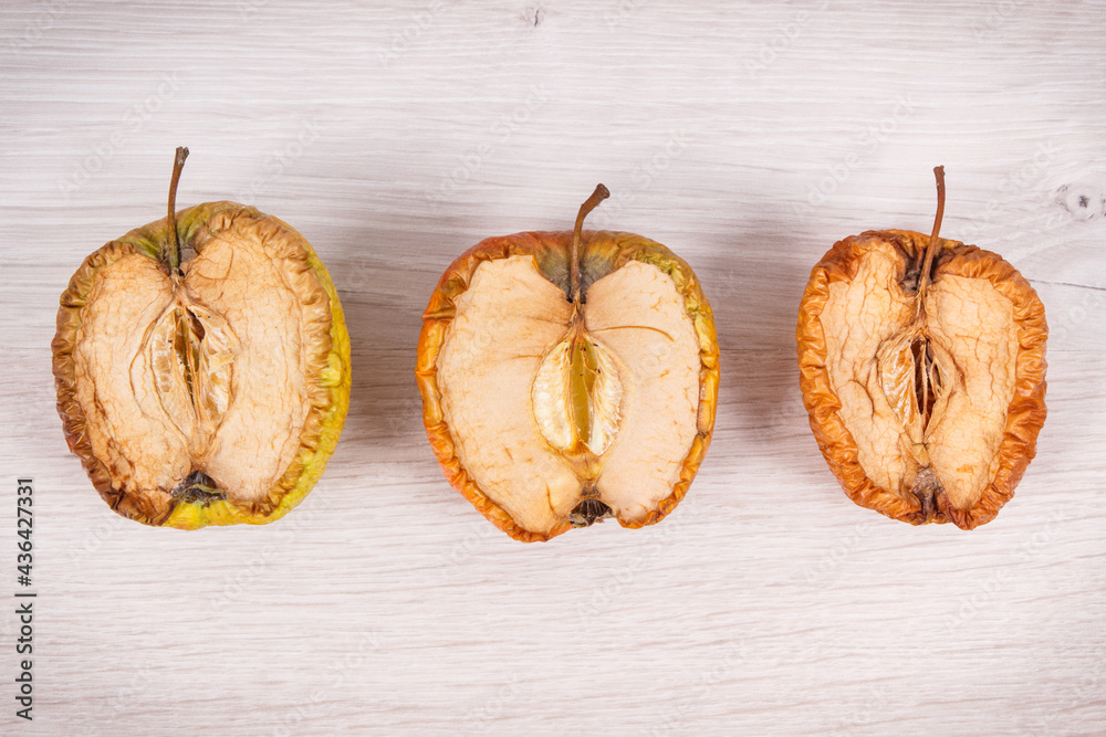 Old moldy apple, unhealthy and disgusting fruit Stock Photo | Adobe Stock