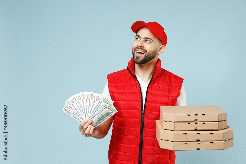 Delivery guy employee man in red cap white T-shirt vest uniform work ...