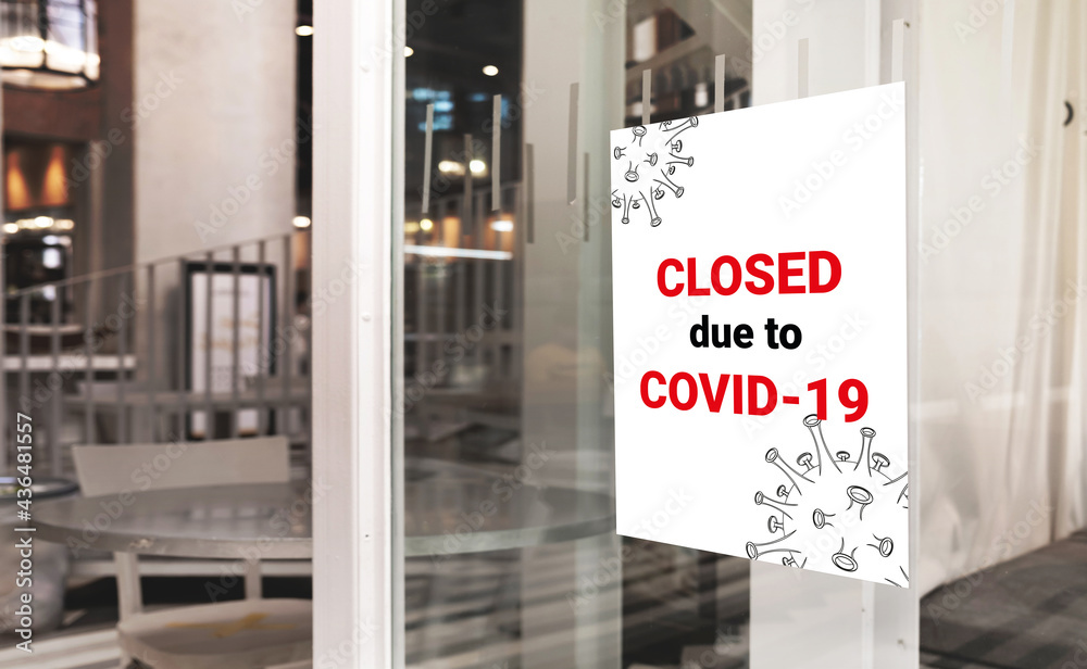 Posters announce in front of business offices or stores that have ...