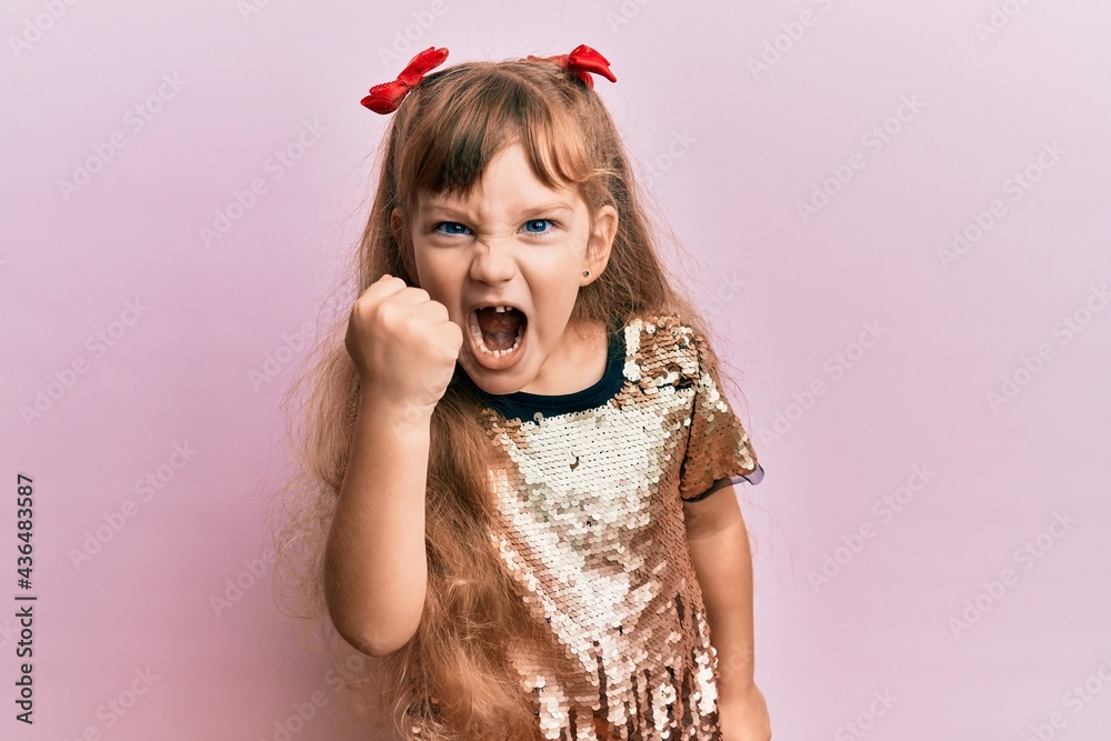 Little caucasian girl kid wearing festive sequins dress angry and mad ...