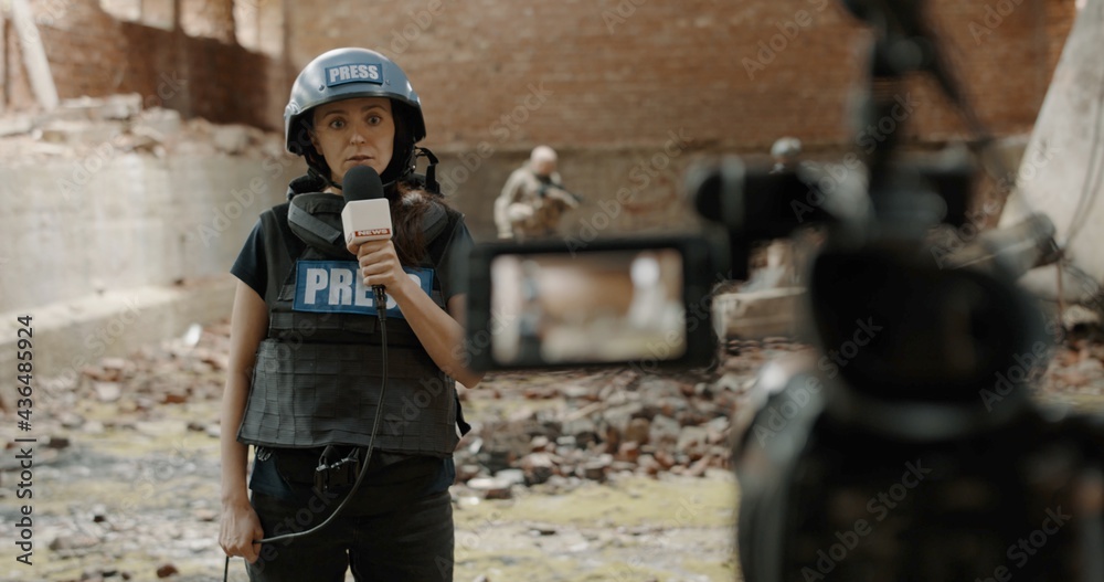 Behind the scenes of female war journalist correspondent wearing ...