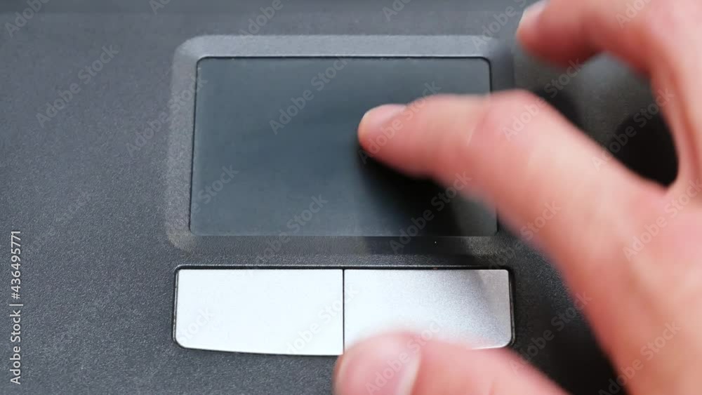 Man using a laptop touchpad, trackpad with two mouse buttons, human ...
