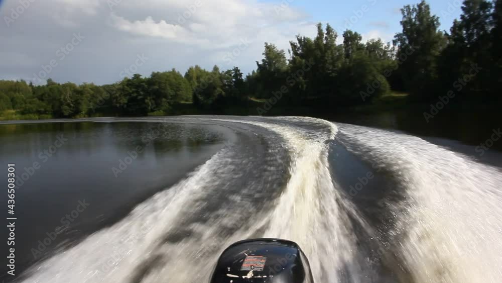 Speedboat turn on the small river water with circle keelwater trail on ...