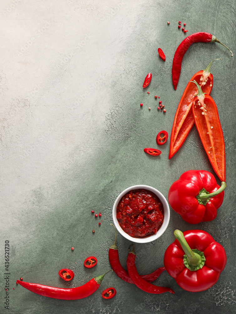 Composition with tasty chili sauce and ingredients on color background ...
